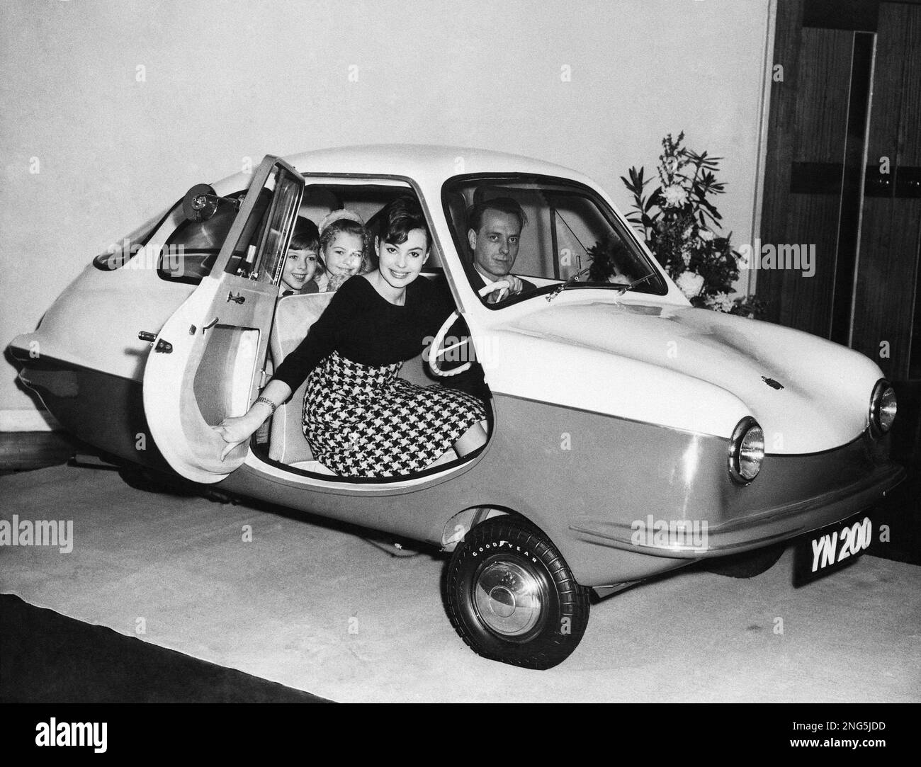 With four persons seated comfortably inside,a new English low priced ...