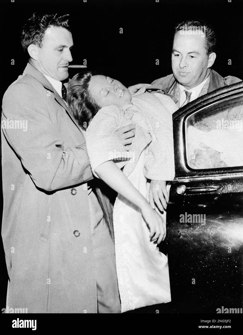 The limp form of actress Susan Hayward is carried from a car at a ...