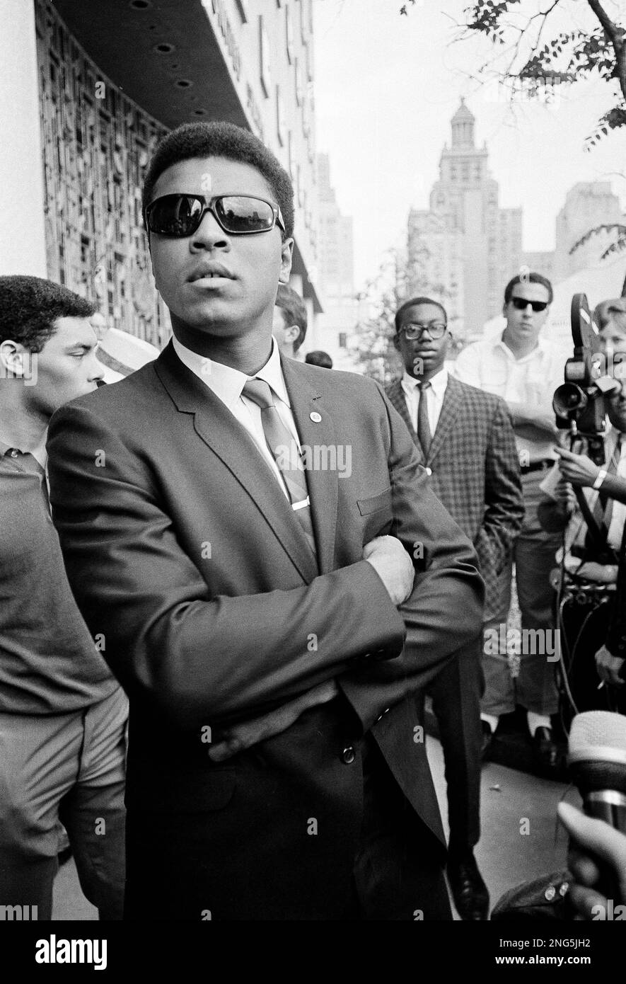 Heavyweight champion Muhammad Ali stands outside the federal court ...
