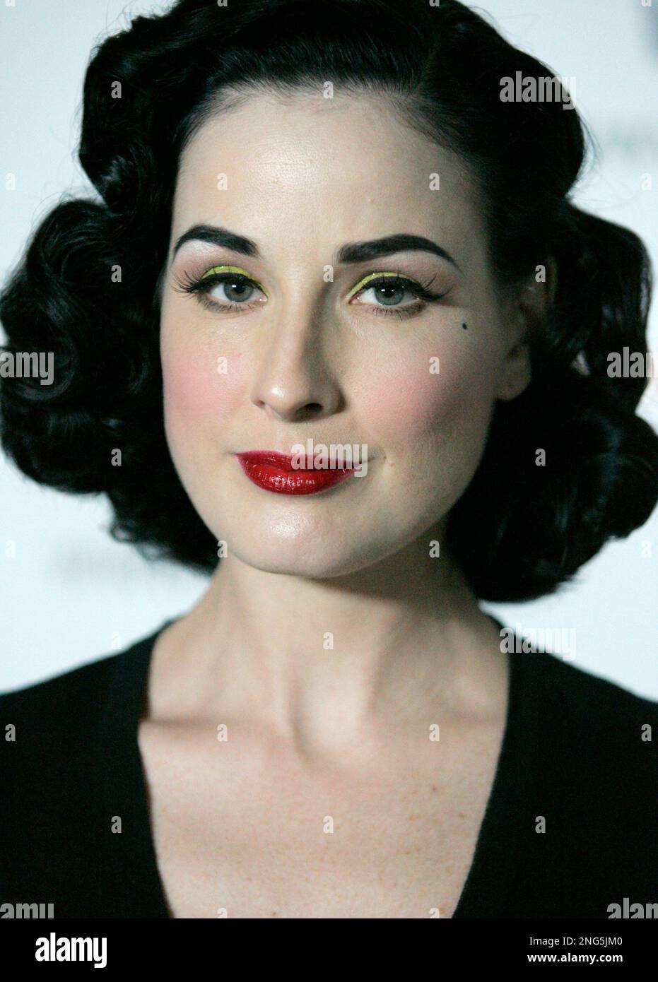 Model Dita Von Teese poses on the press line at a party for the ...