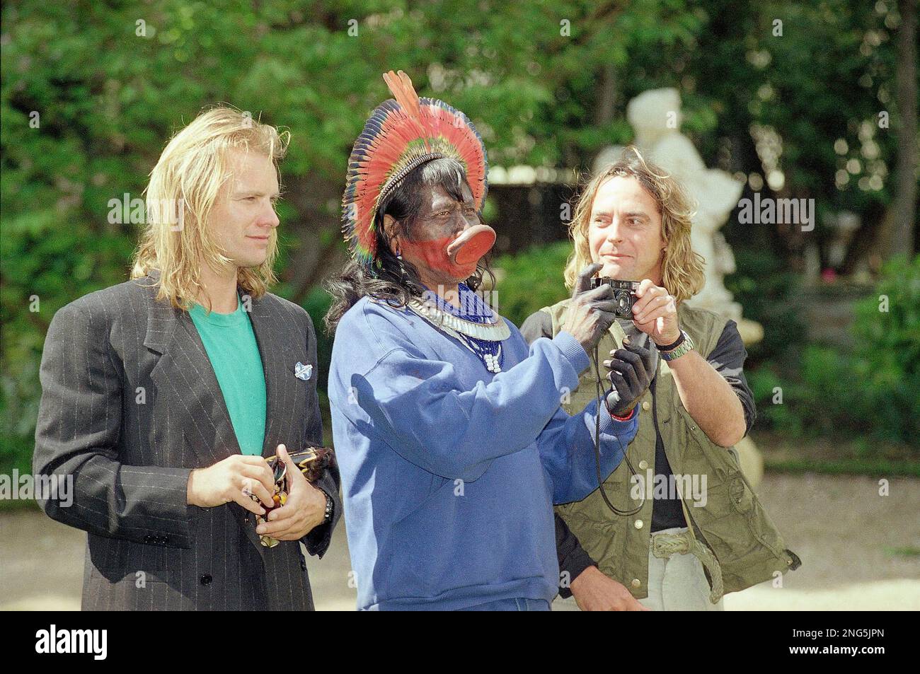 Belgian film-maker Jean-Pierre Dutilleux, right, shows to Indian chief ...