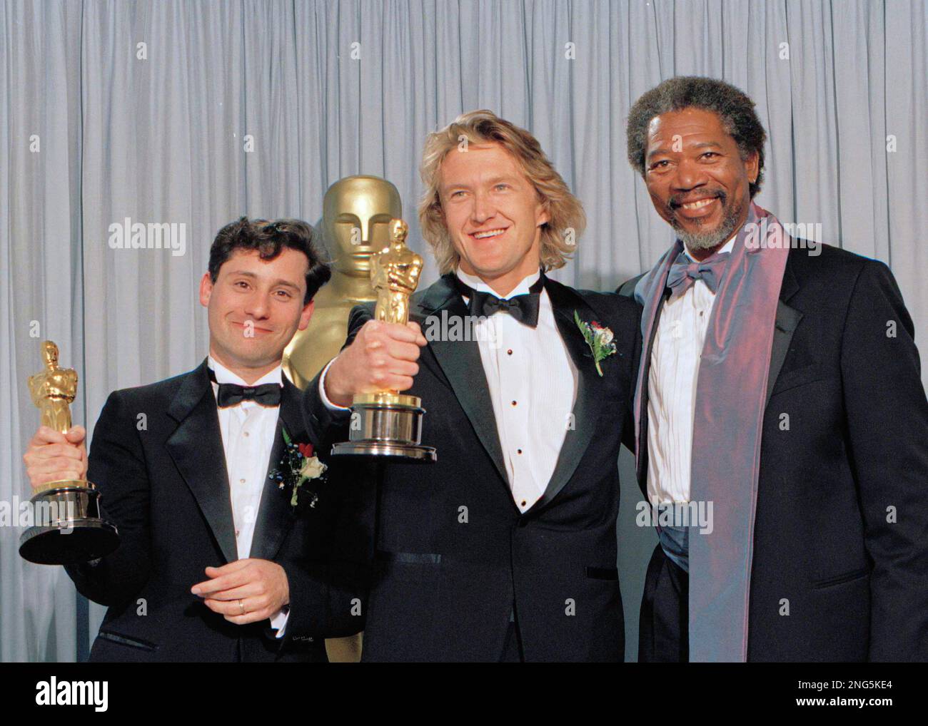 Film editors David Brenner, left, and Joe Hutching, center, stand with ...