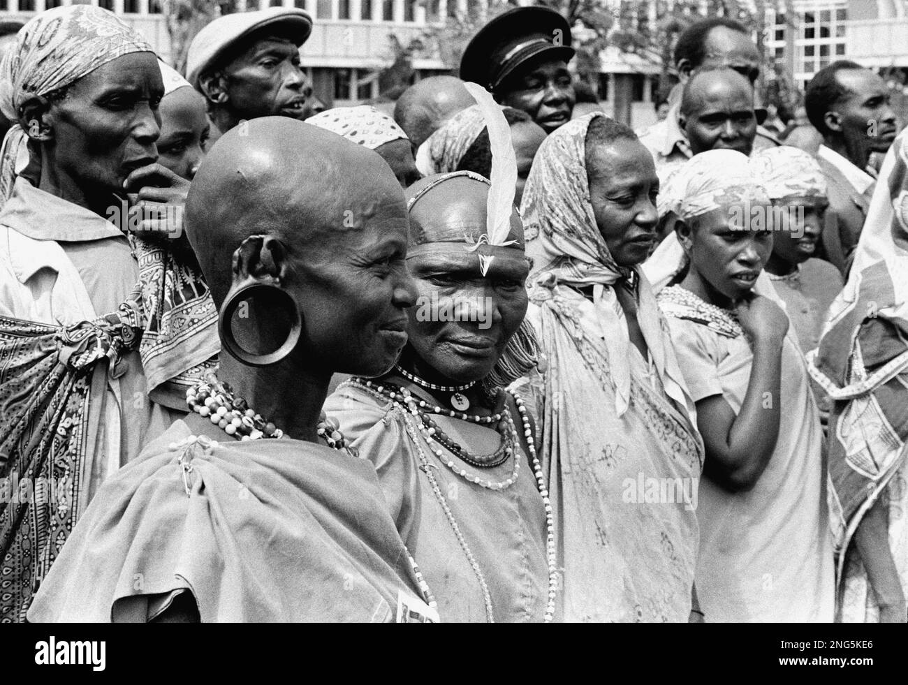 Kikuyu tribeswomen in their colorful traditional dress, wait in Kenya's ...