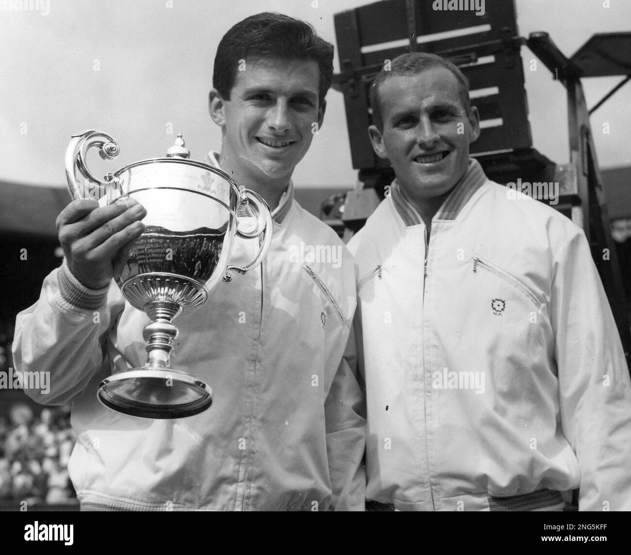 Ashley Cooper, left, holds the winner's trophy and poses with Neale ...