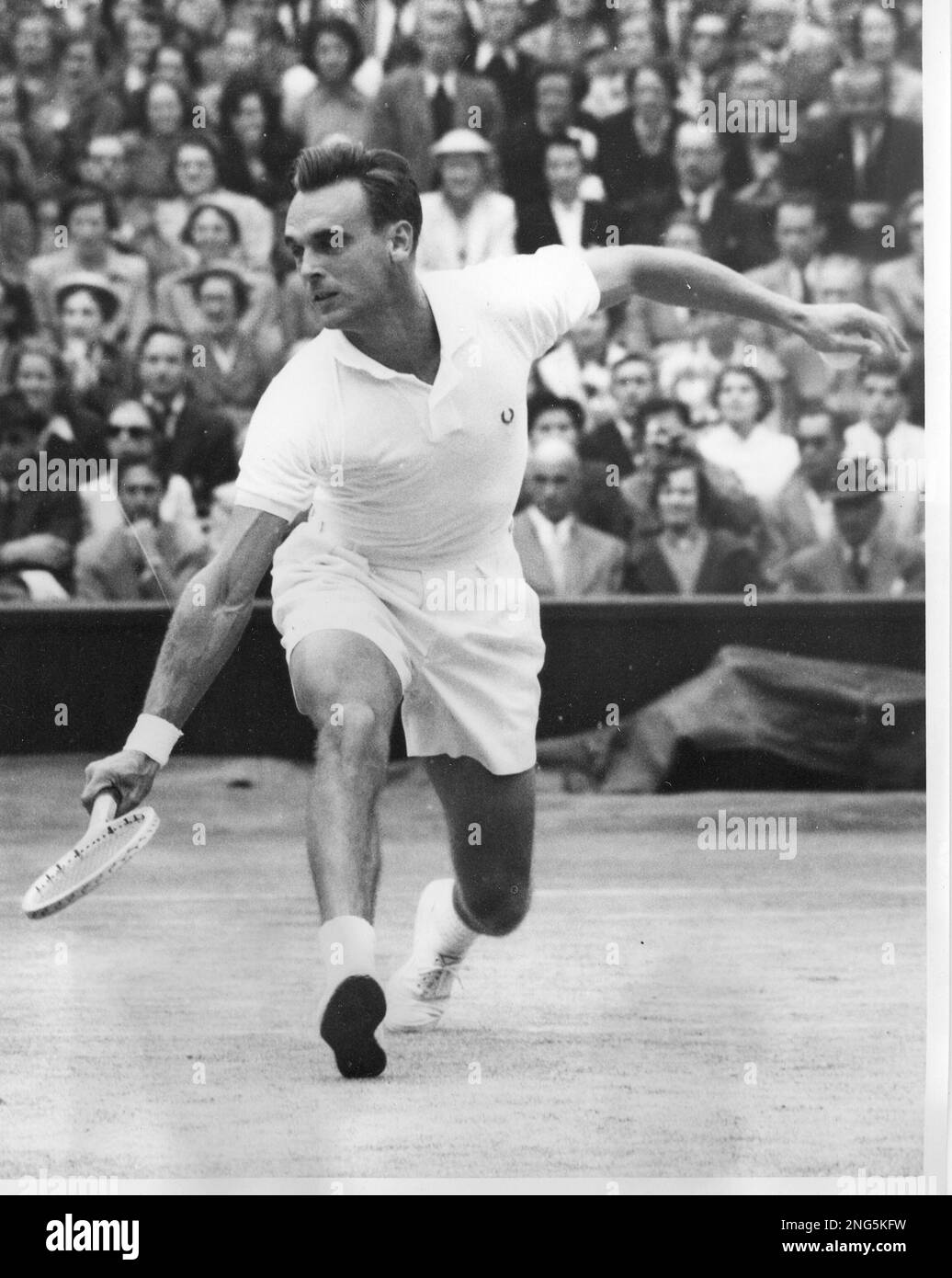Philadelphia's Vic Seixas makes a low backhand return against Denmark's ...