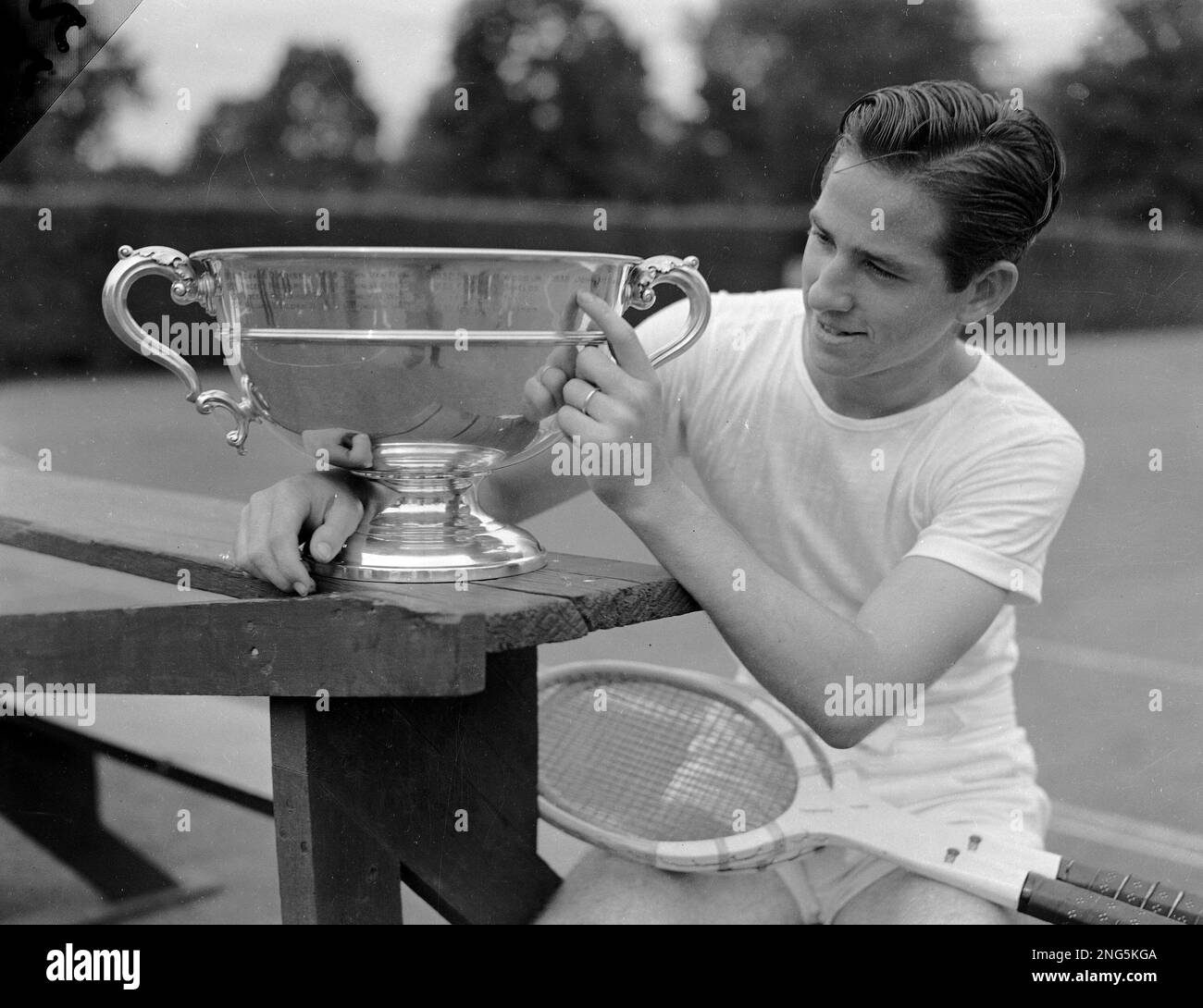 Bobby Riggs is seen with the Wimbledon men's singles championship cup ...