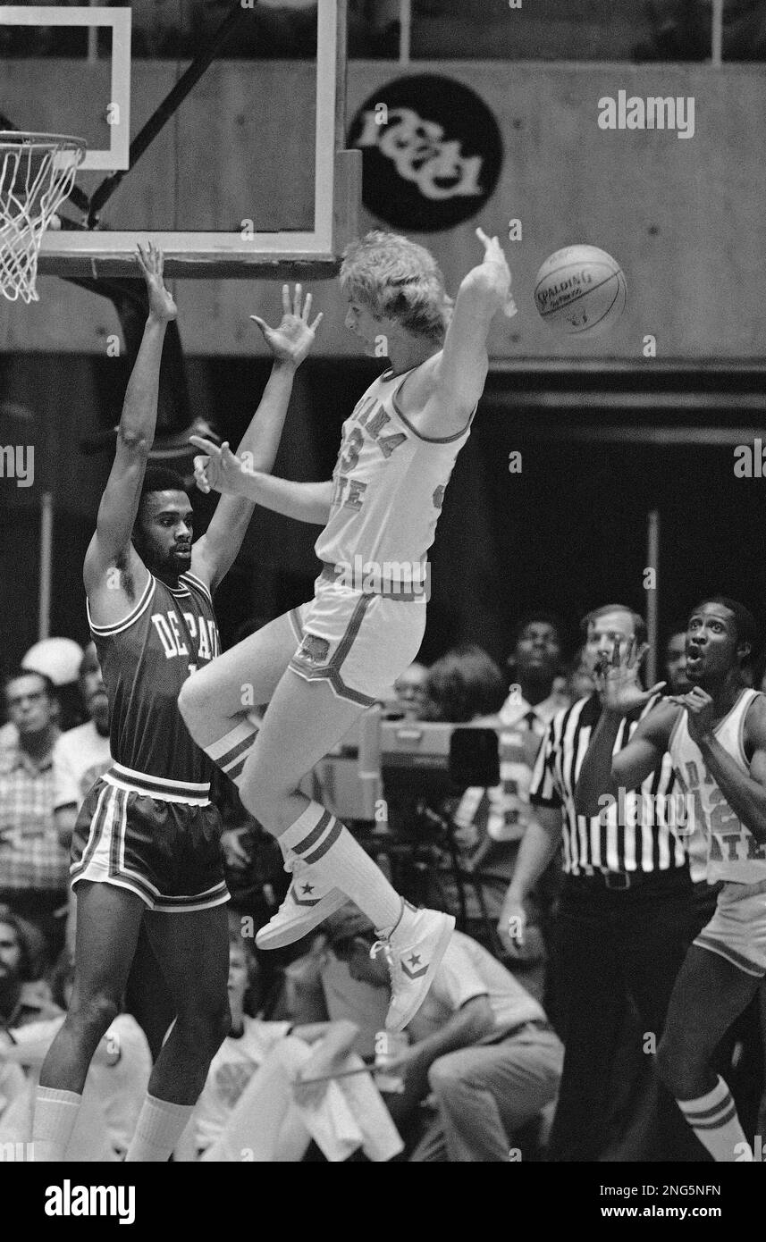 Indiana State's Larry Bird passes the ball backwards to teammate Alex ...