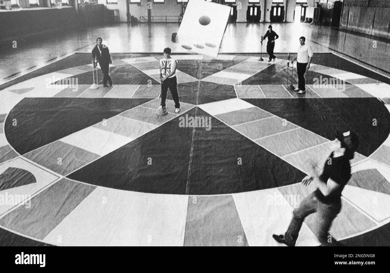 J.D. Panigall tosses an oversized die while some of his classmates at ...
