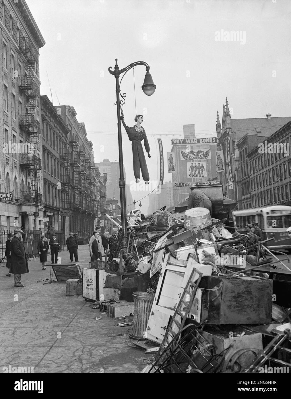 An effigy of Adolf Hitler dangles by its neck from a lamp post above a ...