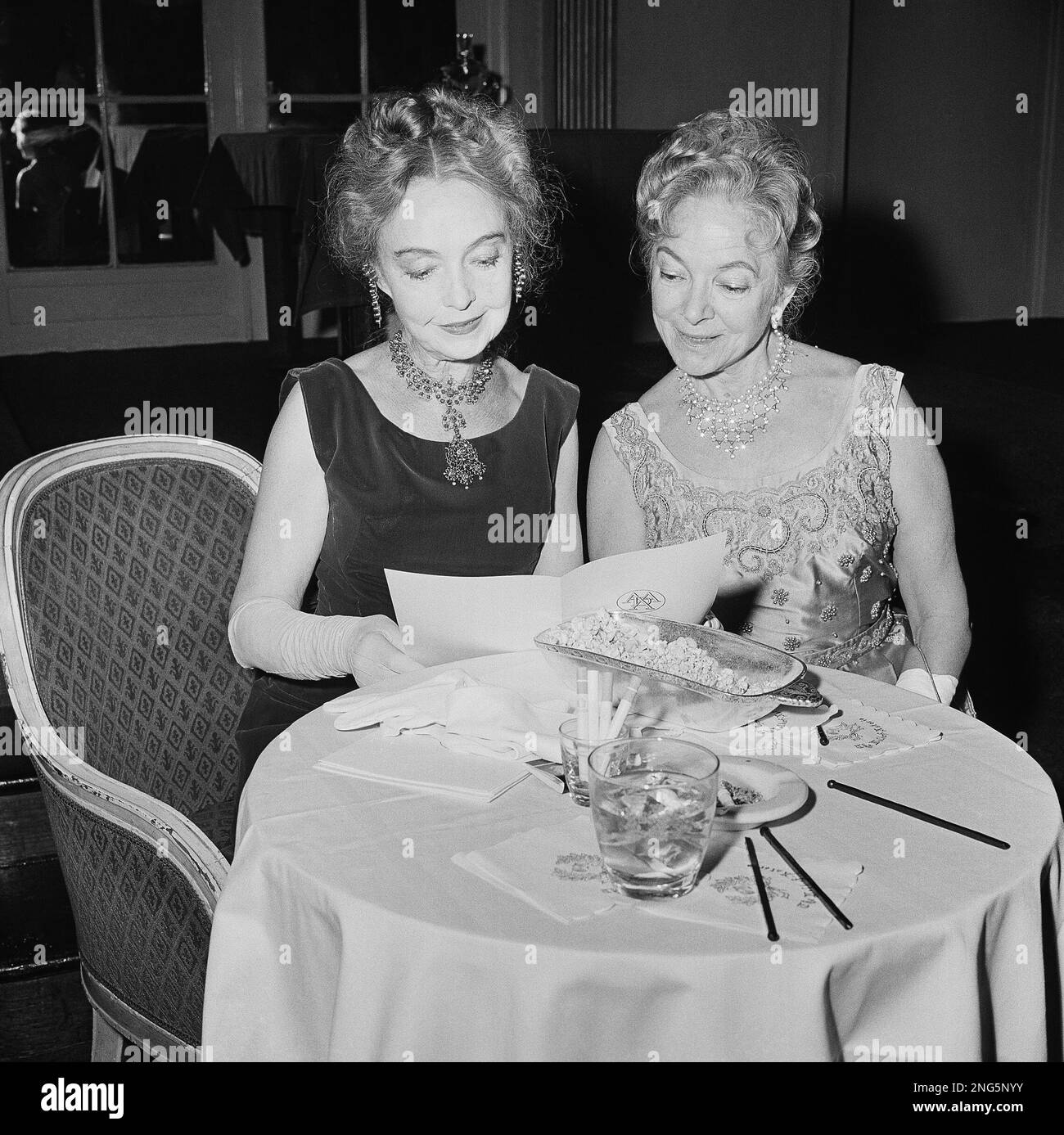 Lillian Gish, left, and Helen Hayes look over program during annual ...
