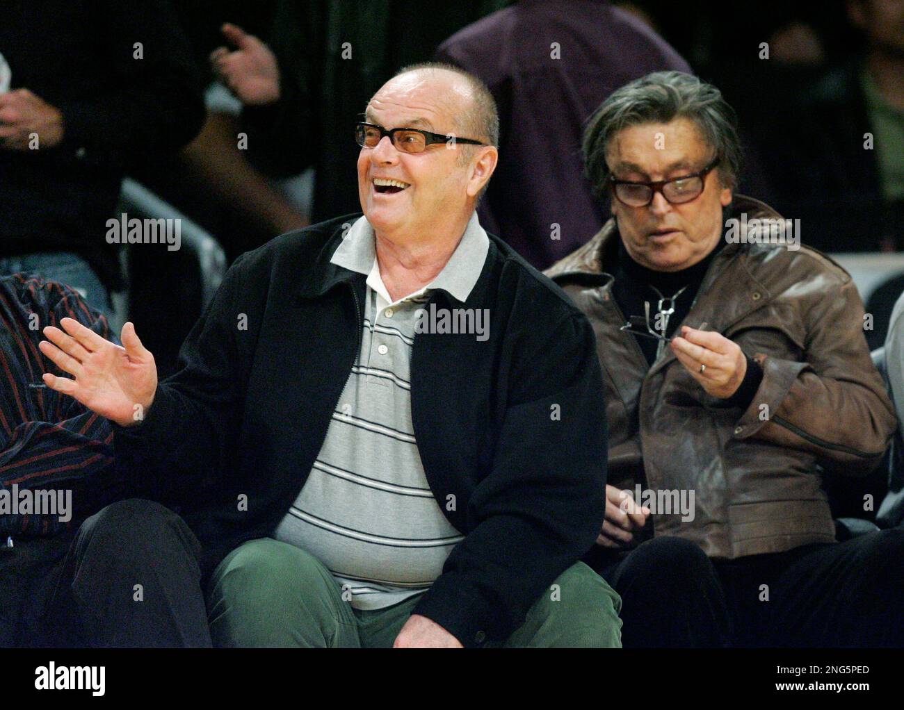 Actor Jack Nicholson, left, seated courtside with producer Robert Evans ...