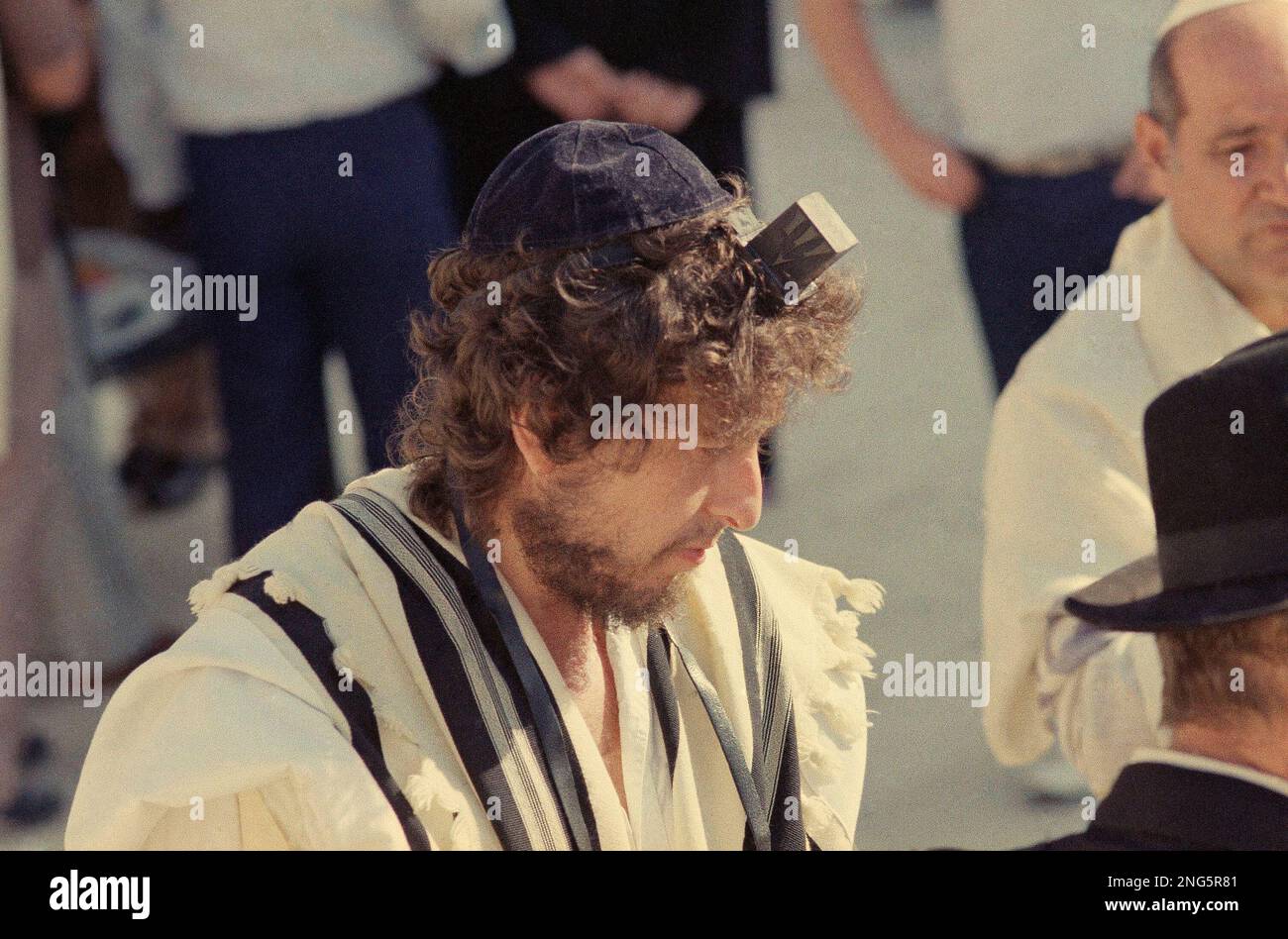 Singer Bob Dylan at the Bar Mitzvah of his son at the Wailing Wall, a ...