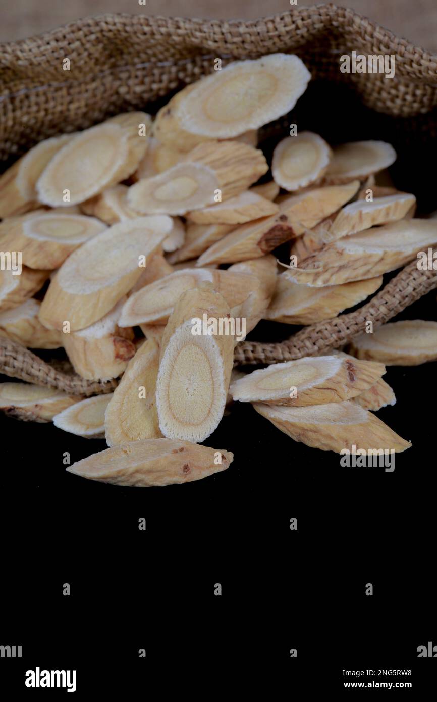 Chinese herbal medicine astragalus membranaceus on a white background ...
