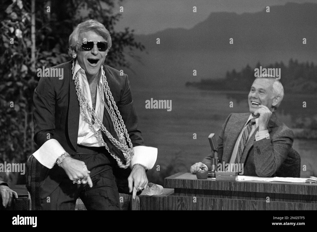 Comedian Steve Martin left, festooned with mock jewelry and other ...