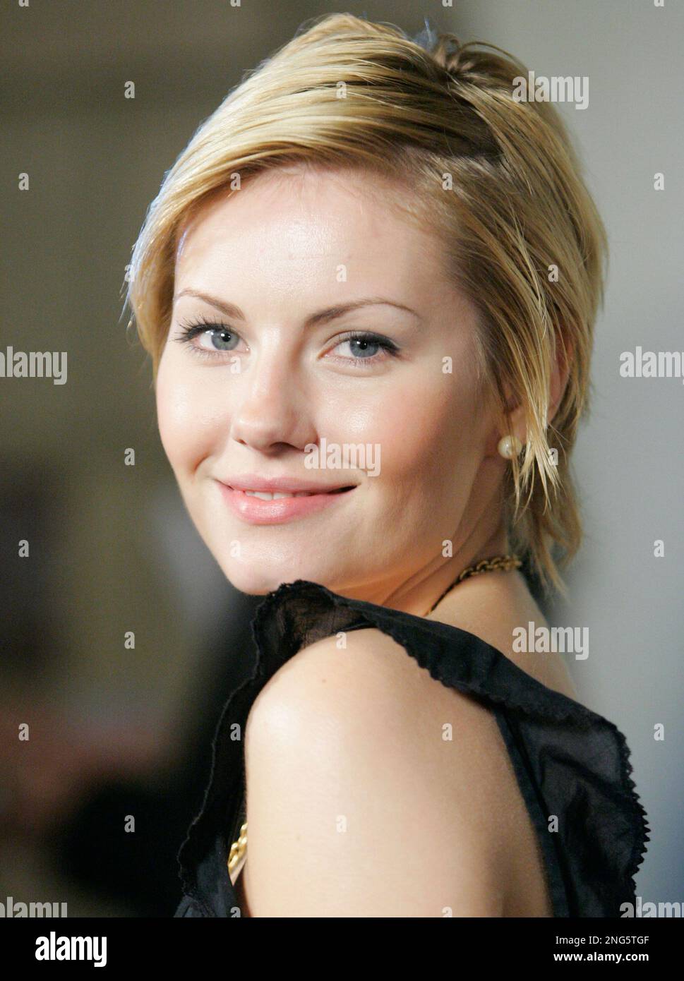 Actress Elisha Cuthbert poses on the red carpet at the 2 B Free fashion ...