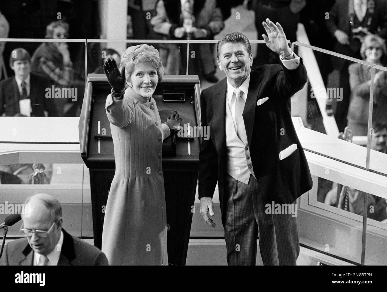 President Ronald Reagan and first lady Nancy Reagan wave to onlookers ...