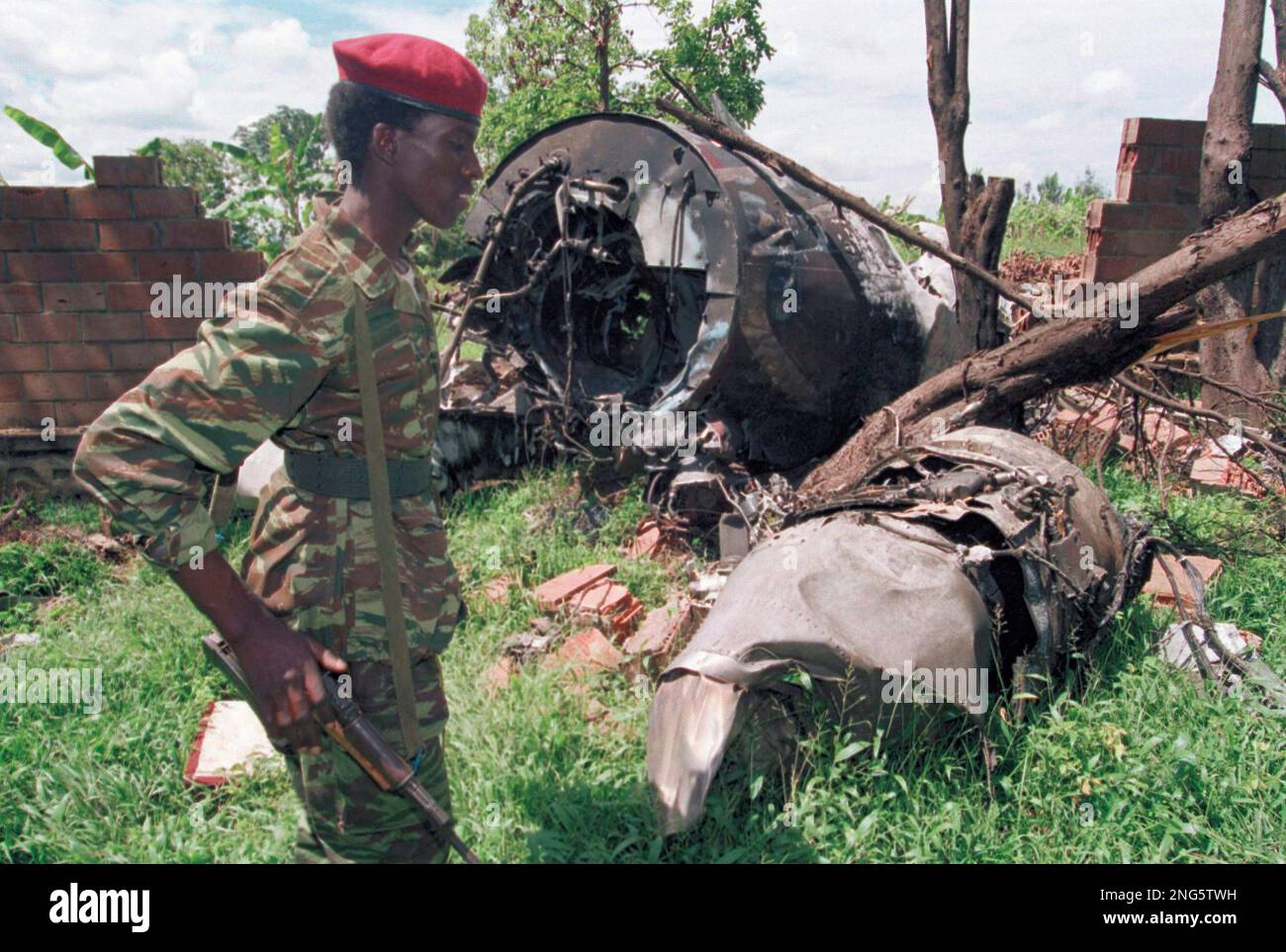 A Rwanda Patriotic Front (RPF) rebel walks Monday, May 23, 1994, by the ...