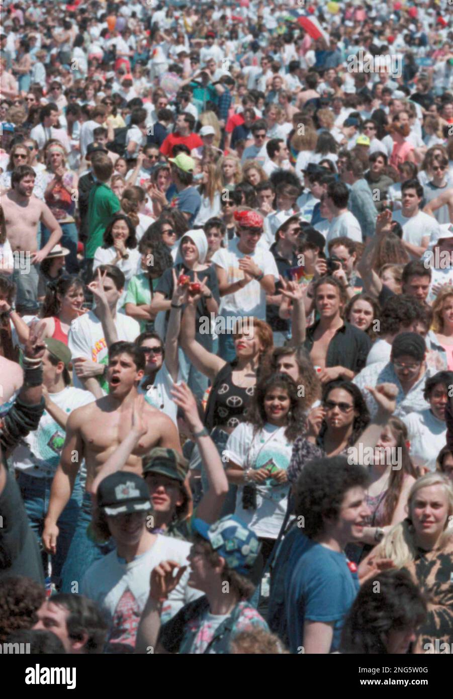 A crowd estimated at about 300,000 New Yorkers bask in the 70-degree ...