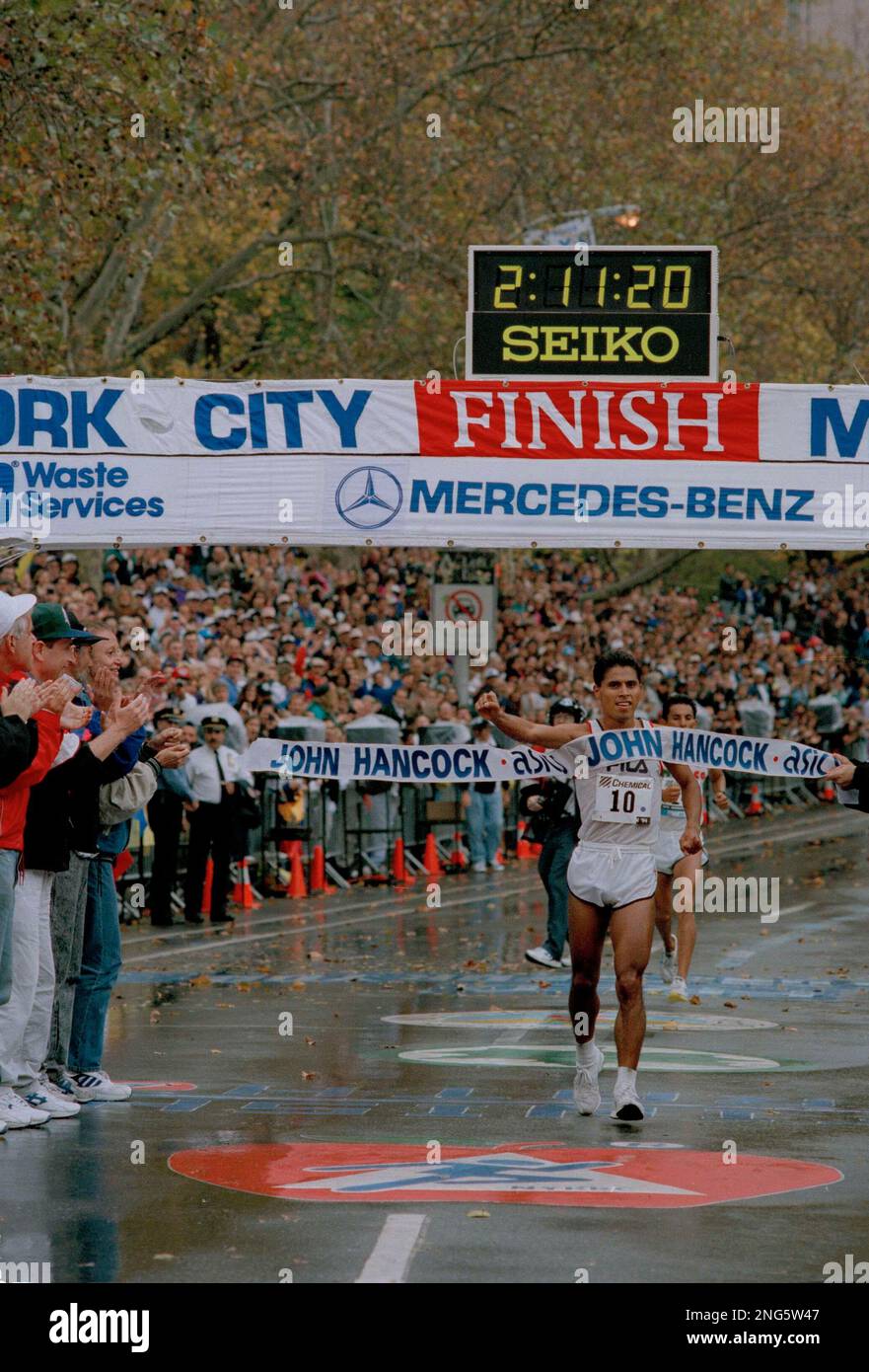 German Silva of Mexico raises his fist as he crosses the finish line in ...