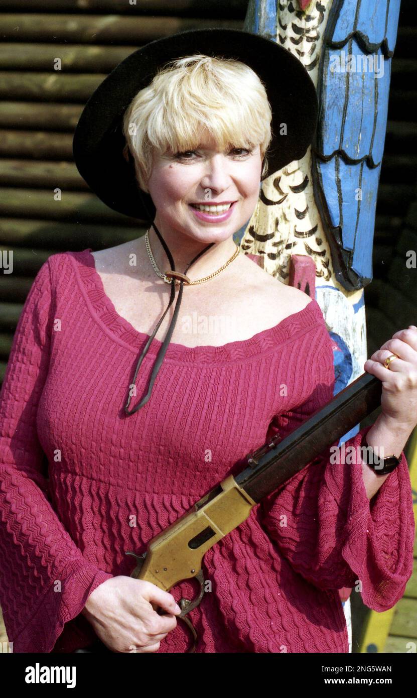 German actress Ingrid Steeger holds a vintage rifle, the Henry Stutzen ...