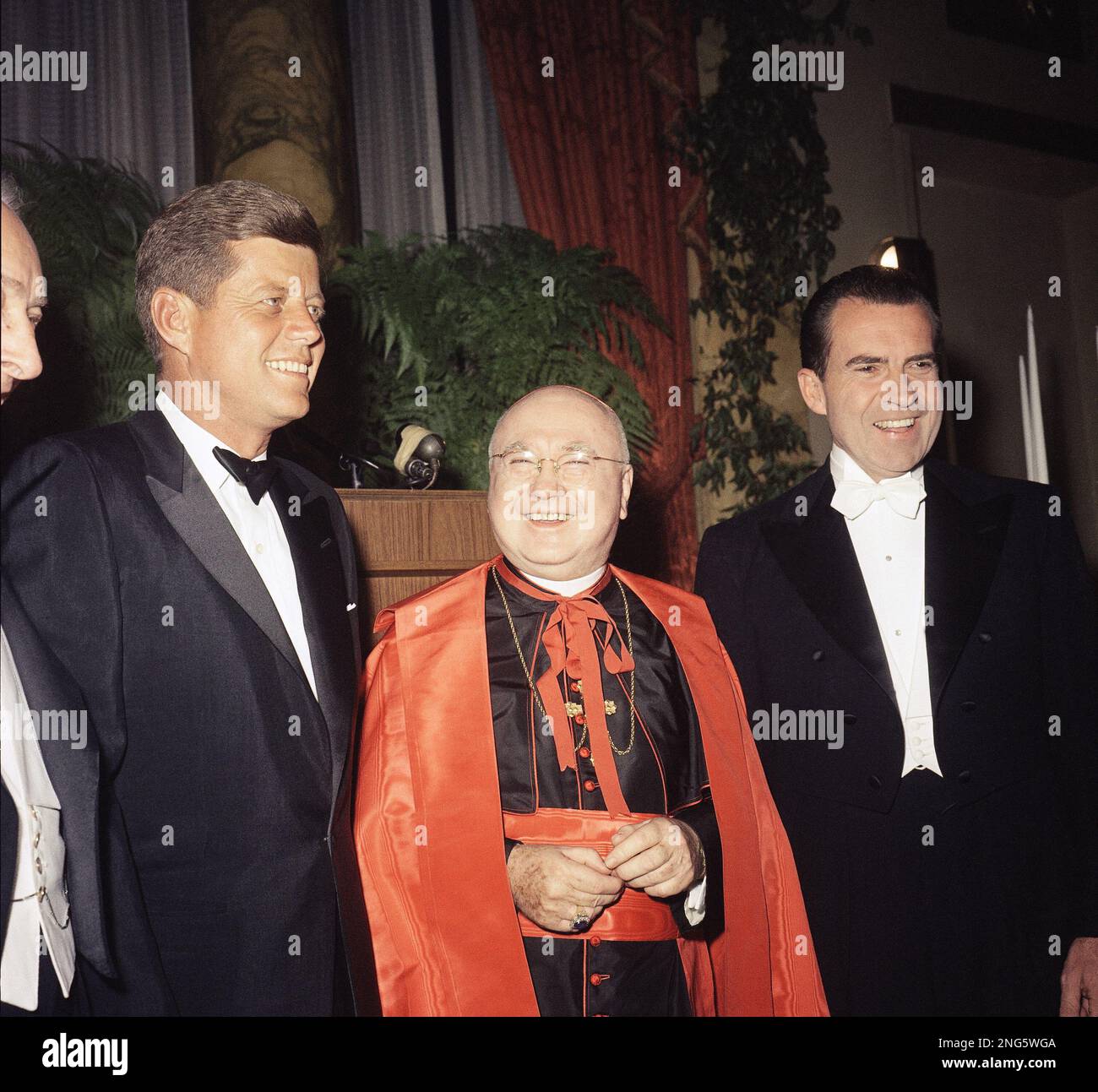 Senator John F. Kennedy, left, joins Francis Cardinal Spellman, center ...