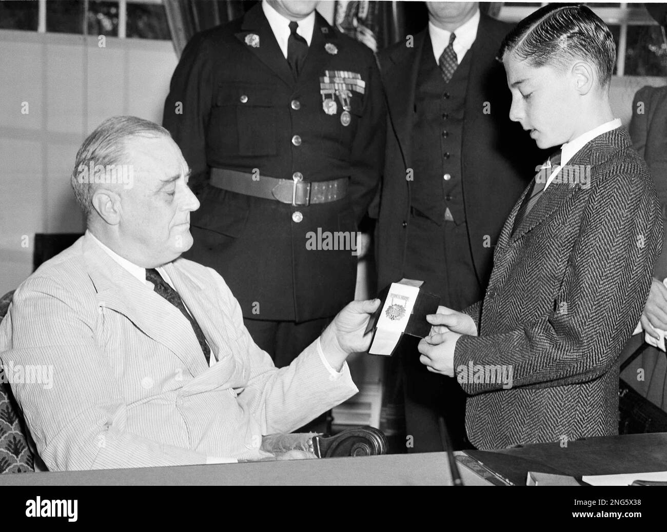 Boy Scout Donn Fendler is honored by President Franklin Roosevelt with ...