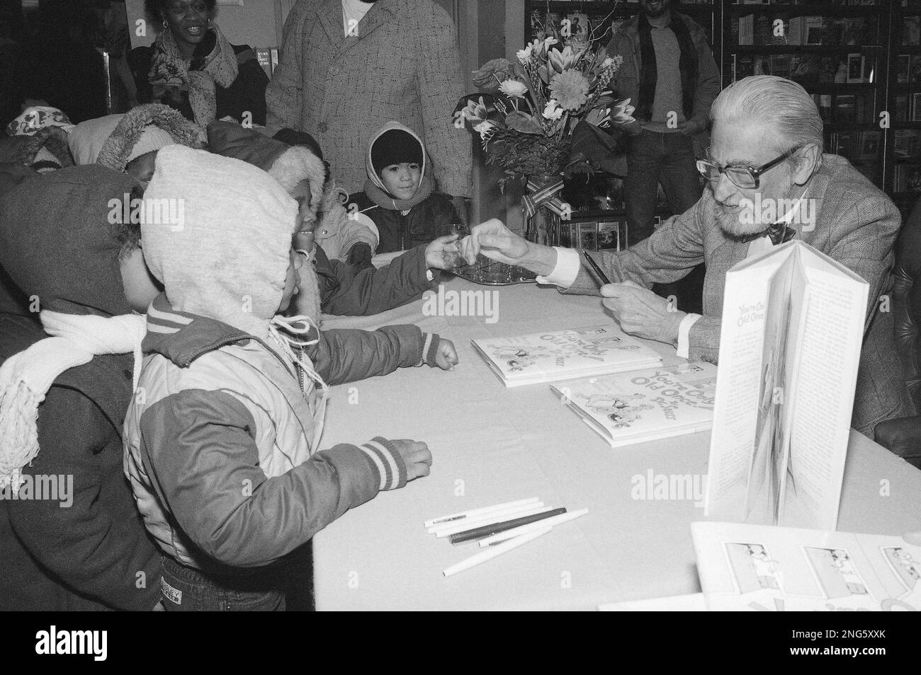 Theodor Seuss Geisel, know as Dr. Seuss, talks to some children with ...