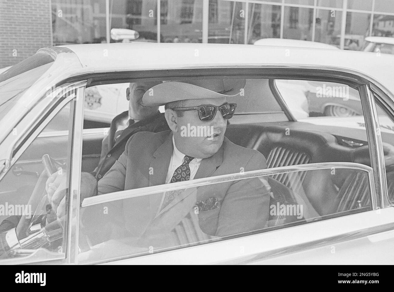Neshoba Country Deputy Sheriff Cecil Price peers from his car window on ...