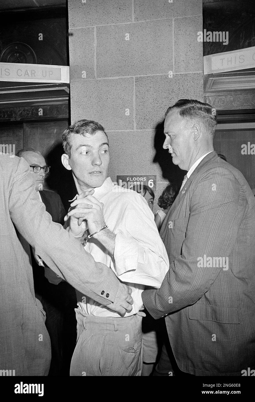 Edward Albert Seibold, 21, looks over his shoulder as he leaves Miami's ...