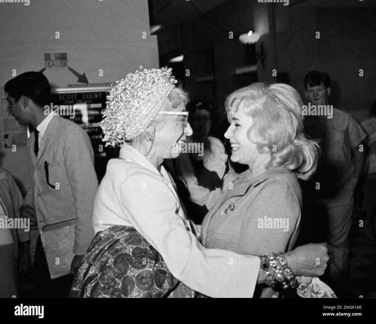 An unidentified woman hugs Candace Mossler, right, in the lobby of the ...
