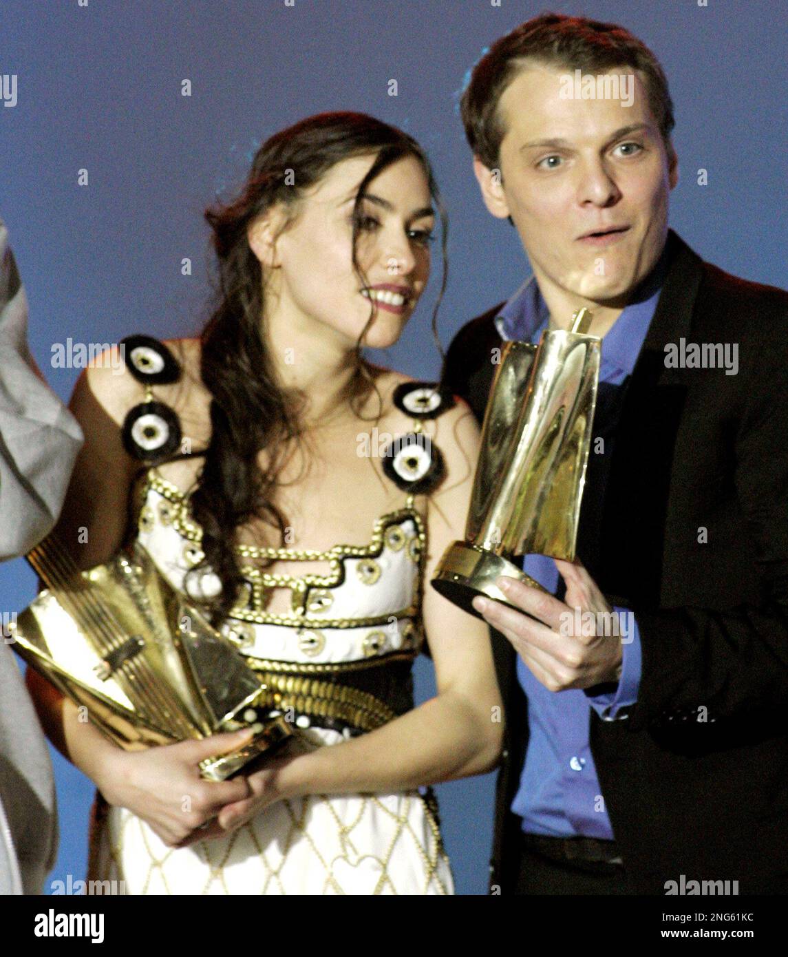 French singers Benabar, right, and Olivia Ruiz pose with their awards ...