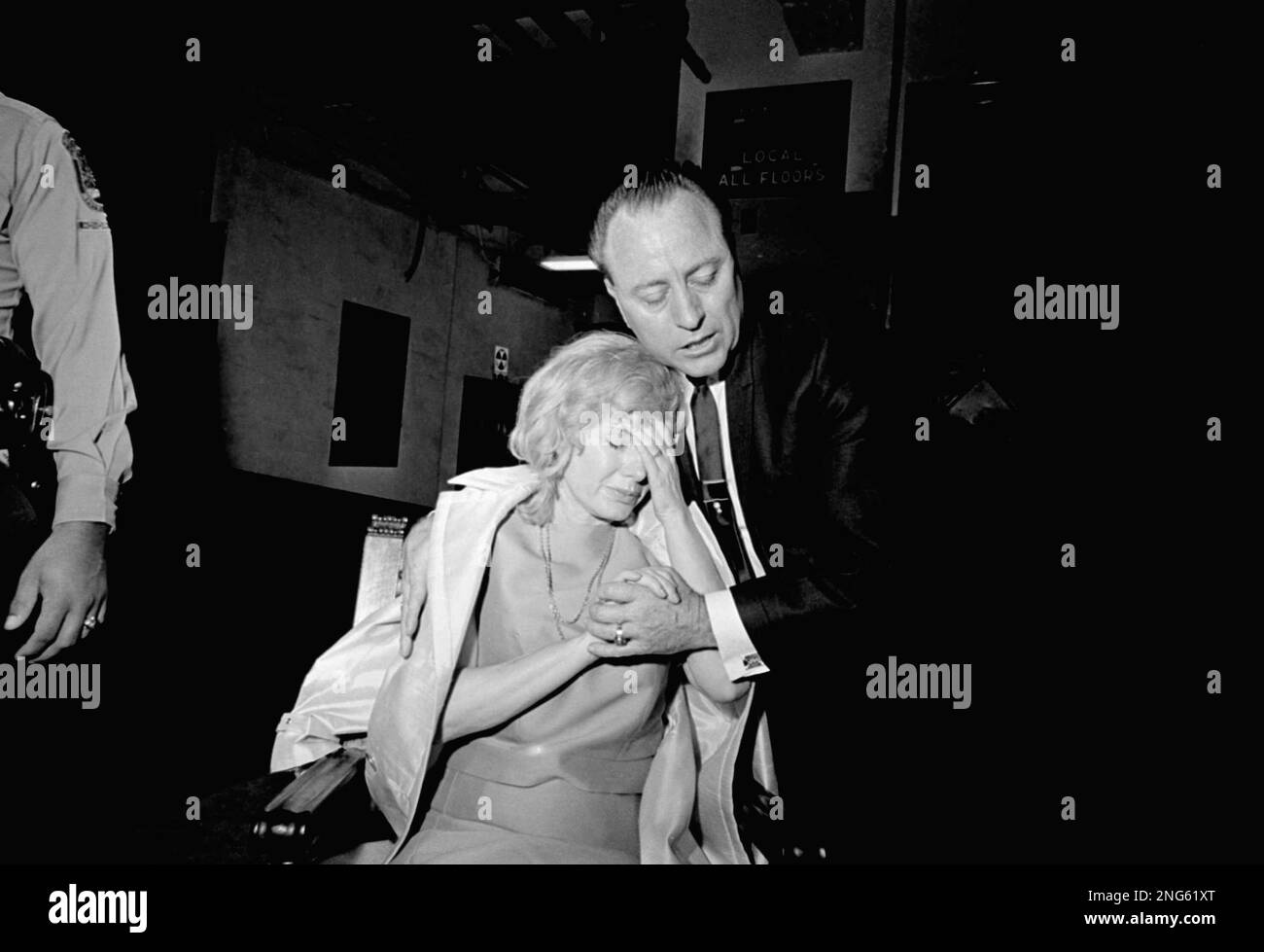 Candace Mossler is assisted from the Miami, Fla. courtroom February 4 ...