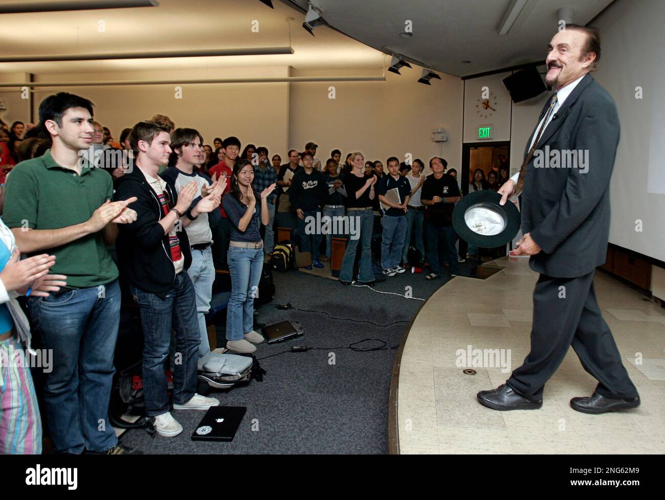Stanford psychology professor Philip Zimbardo, right, gets a standing ...