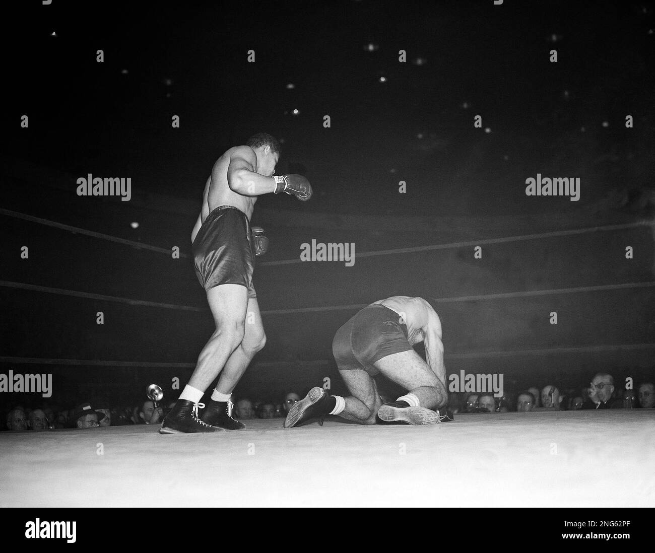 Abe Simon hits the floor early in Friday's fight against Joe Louis in ...