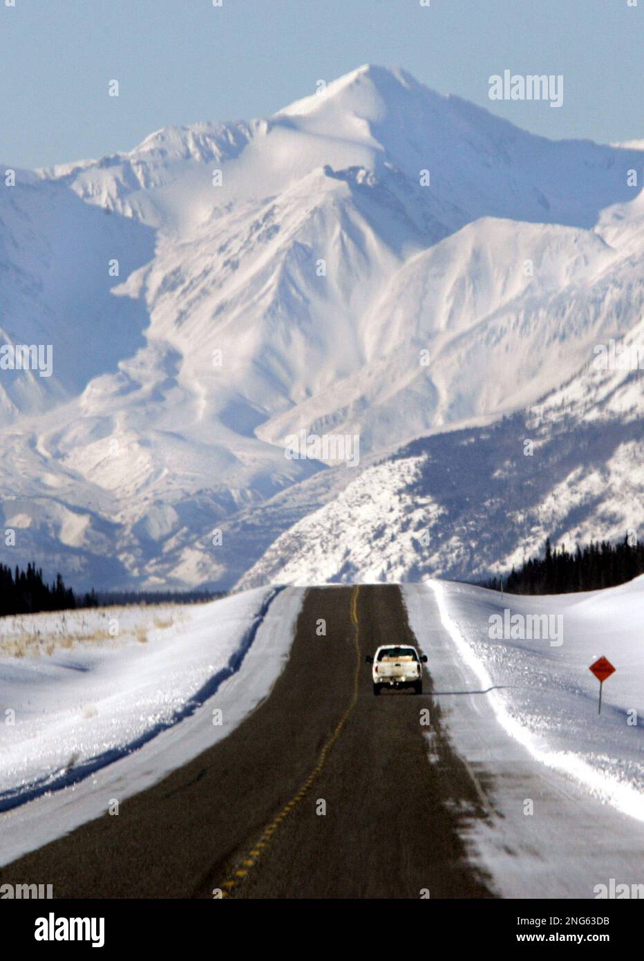 A lone pickup truck travels the Alaska Highway heading towards the St ...
