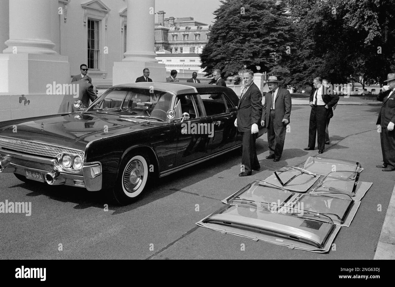 Pres. John F. Kennedy's new plastic-topped limousine sits outside the ...