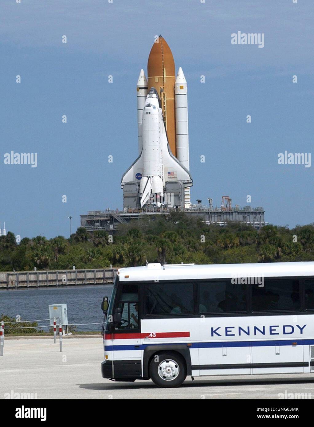 Visitors taking the Kennedy Space Center bus tour get a close up look ...