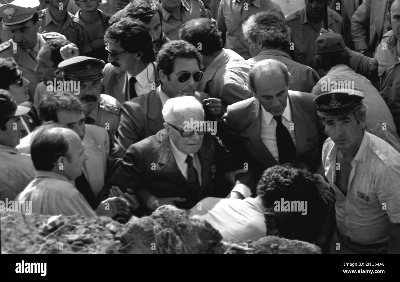 Italian President Sandro Pertini, center, surronded by rescuers of ...