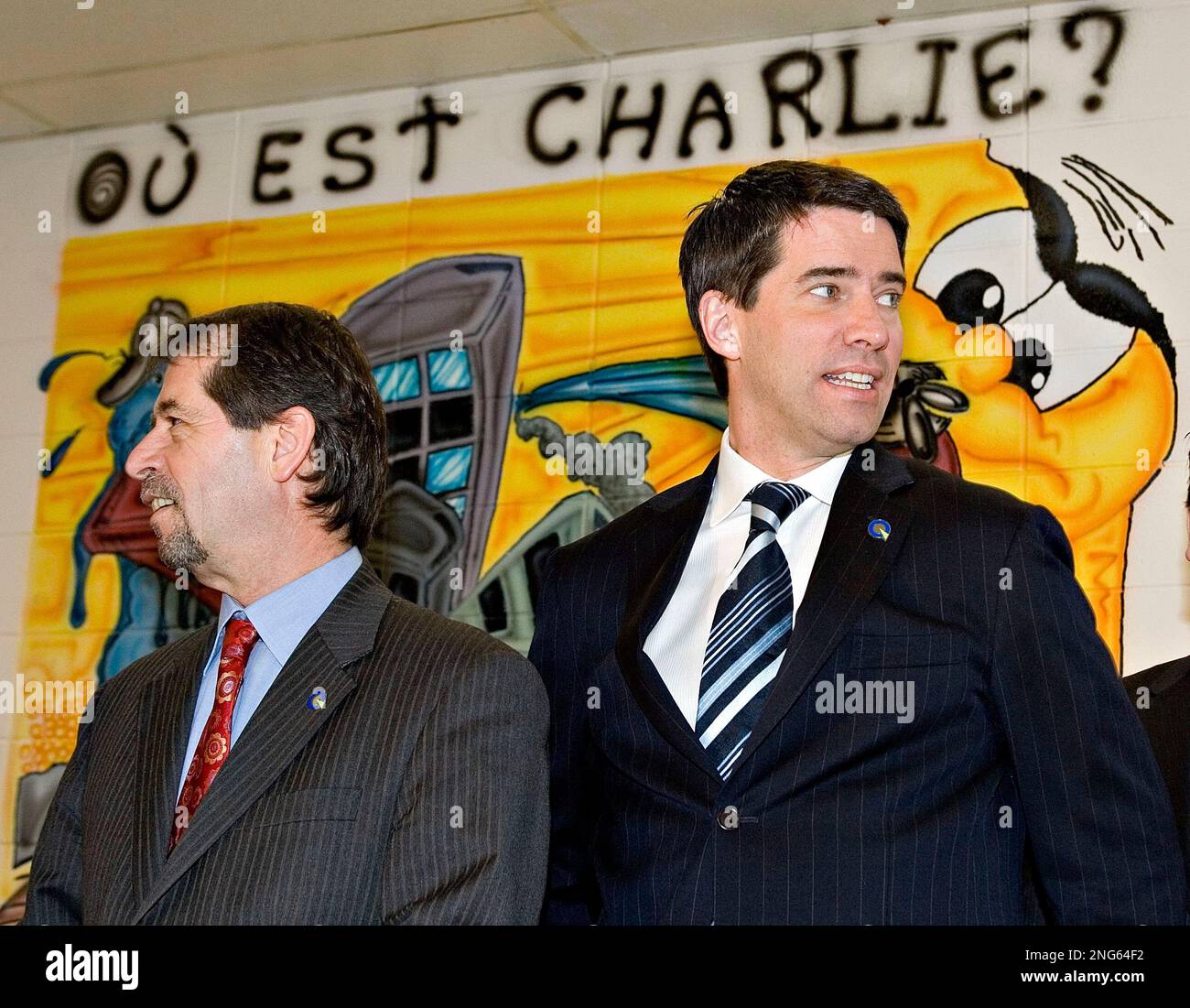 Parti Quebecois Leader Andre Boisclair, right, stands in front of a ...