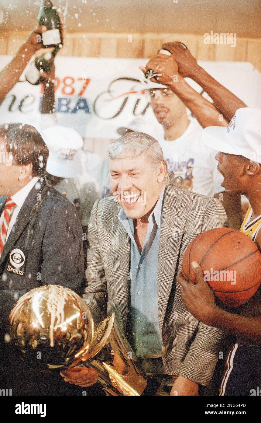 Los Angeles Lakers owner Jerry Buss gets doused with champagne from ...