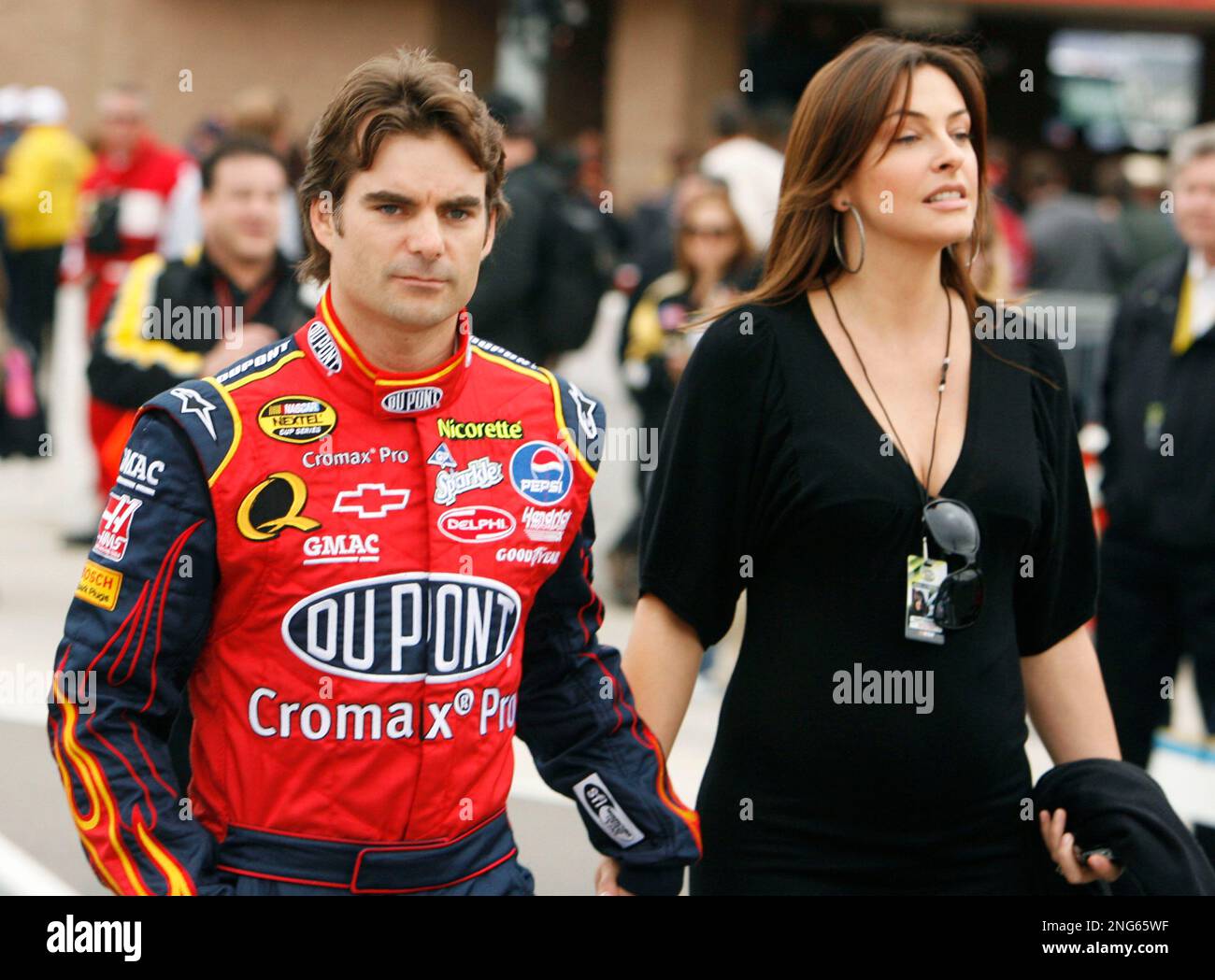 Driver Jeff Gordon, left, and his wife Ingrid Vandebosch walk through ...