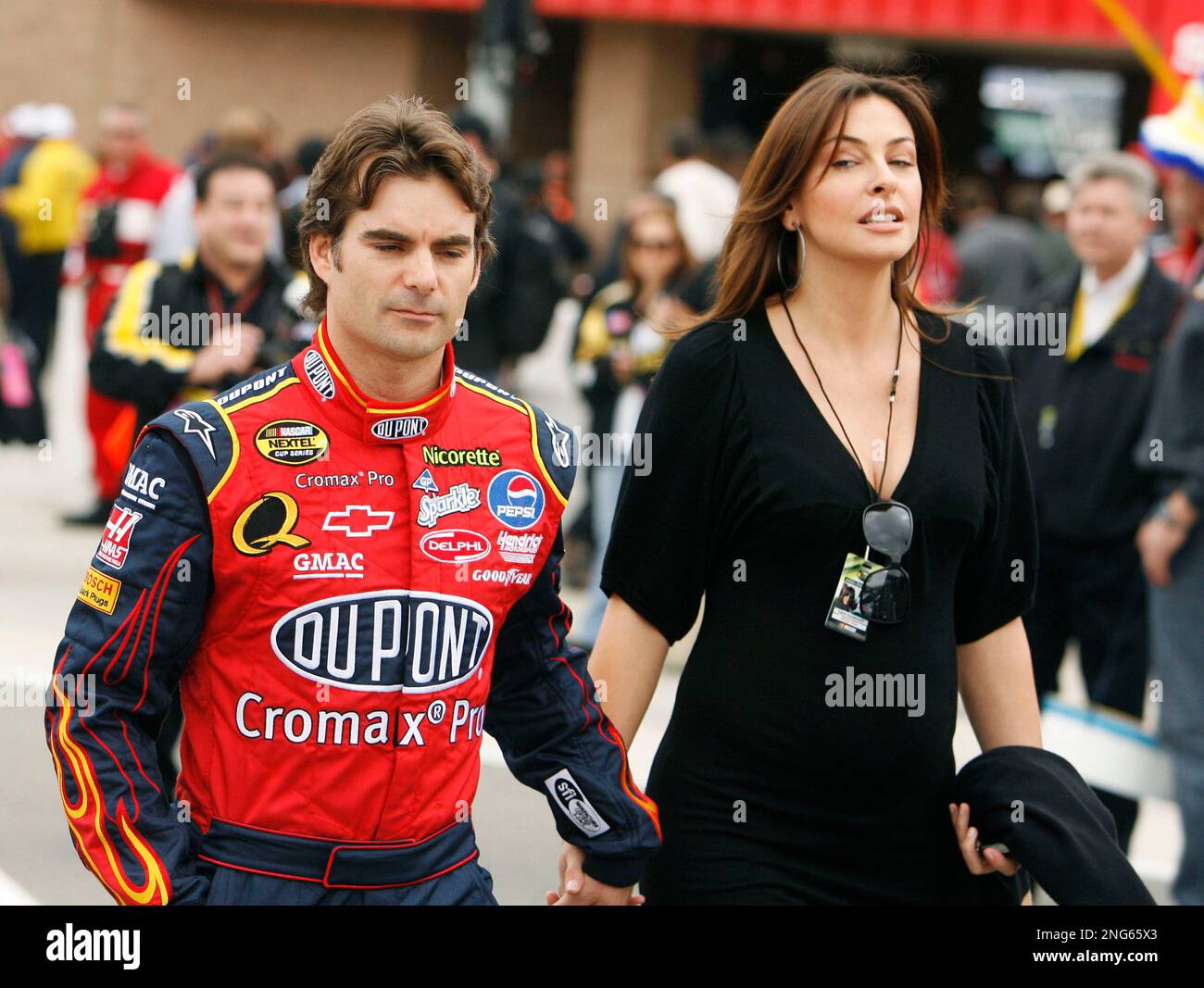 Driver Jeff Gordon, left, and his wife Ingrid Vandebosch walk through ...