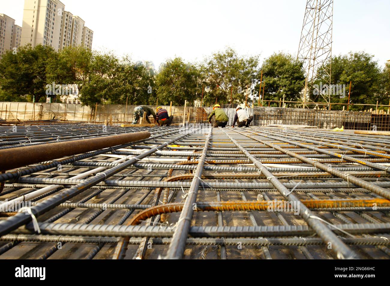 worker in the construction site making reinforcement metal framework ...