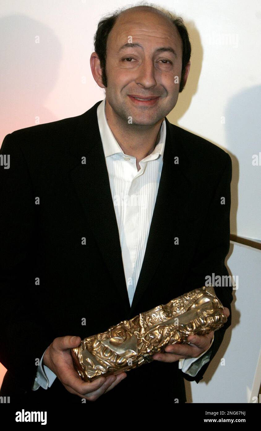 French actor Kad Merad poses with his award for the best supporting ...