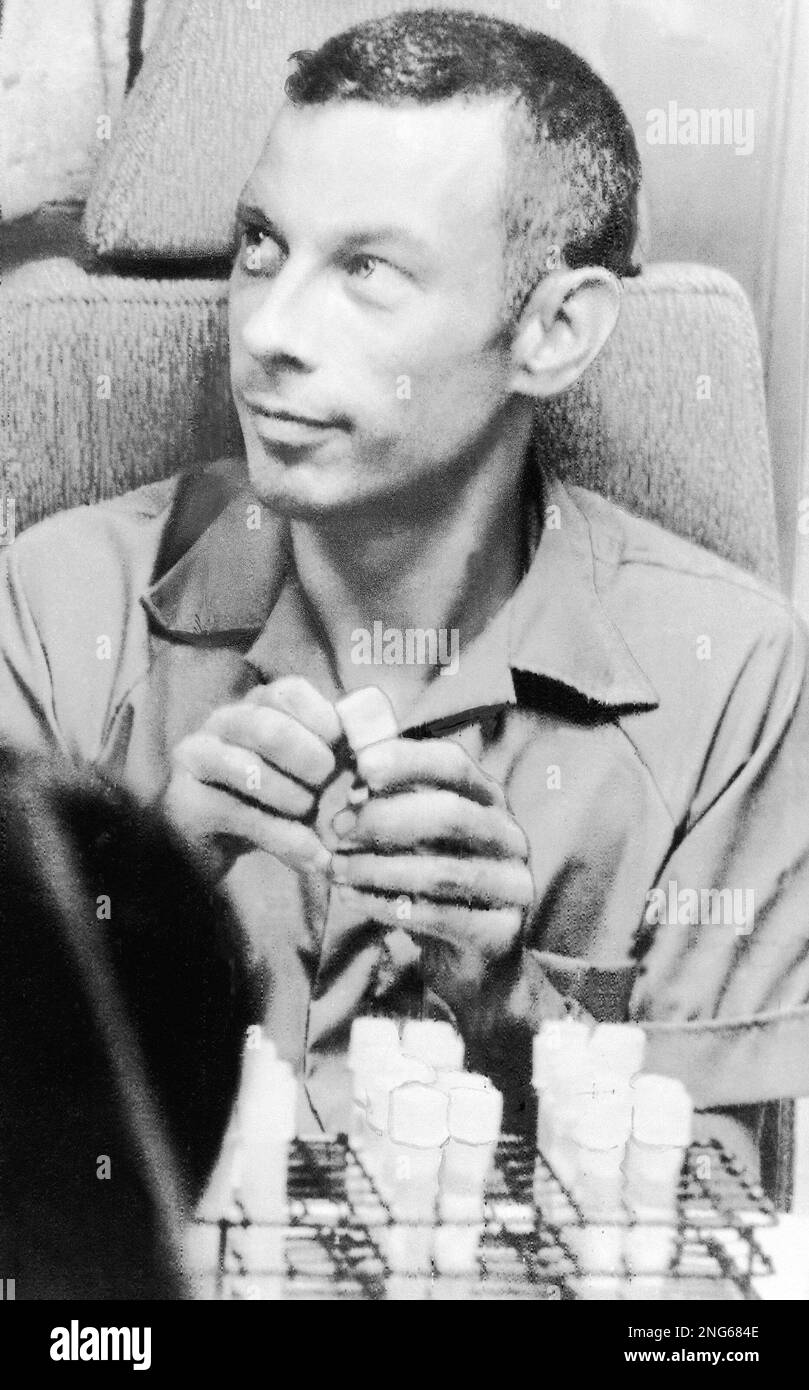 Dr. Bill Carpenter prepares skin swab containers in the mobile ...