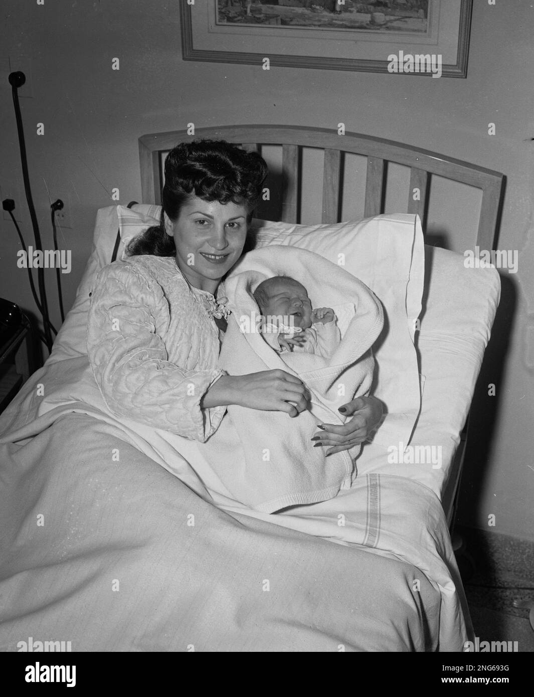 Nancy Sinatra, wife of singer Frank Sinatra, holds their newborn son ...