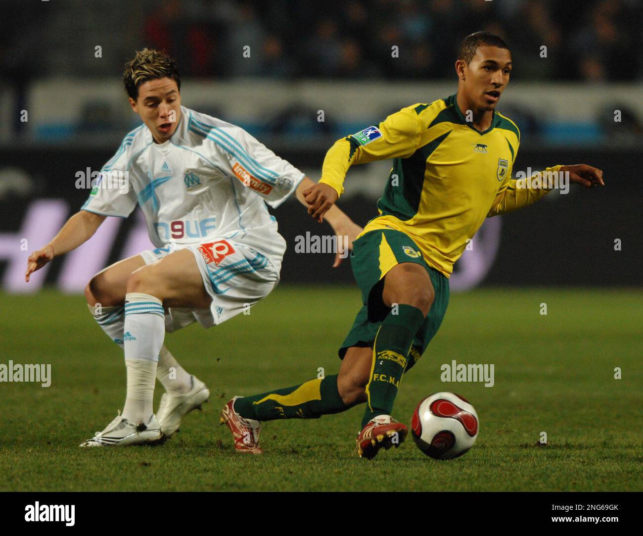 Marseille's midfielder Samir Nasri, left, challenges for the ball with ...