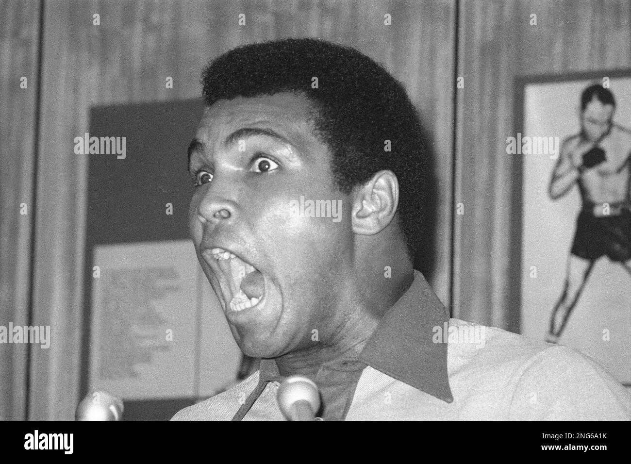 Boxer Muhammad Ali displays an array of facial calisthenics during a ...