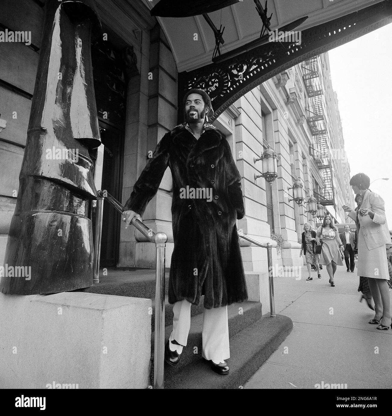 Basketball player Walt Frazier of the New York Knicks models a black ...