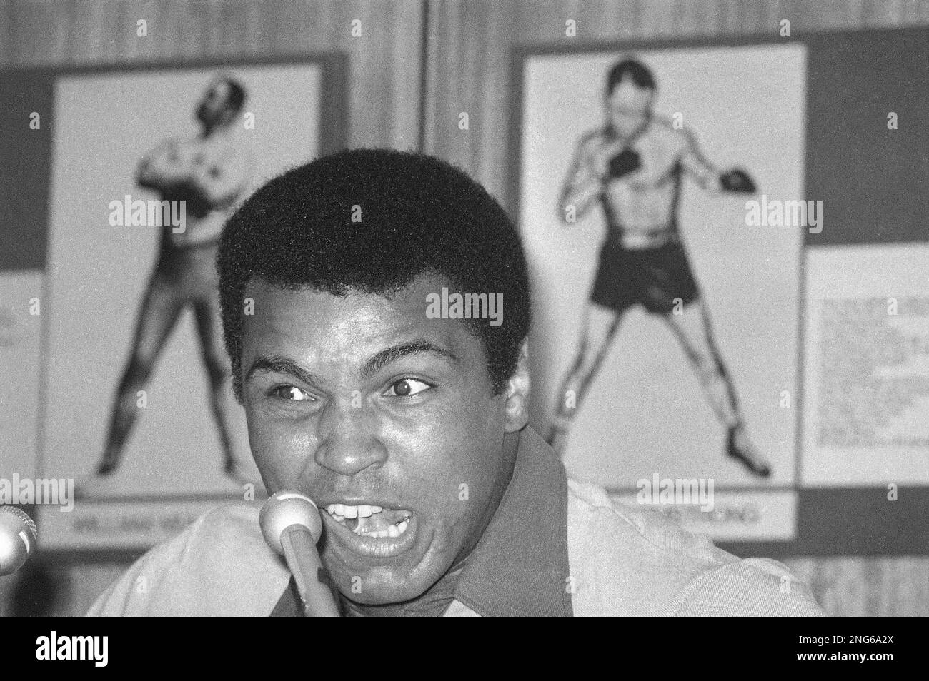 Boxer Muhammad Ali displays an array of facial calisthenics during a ...